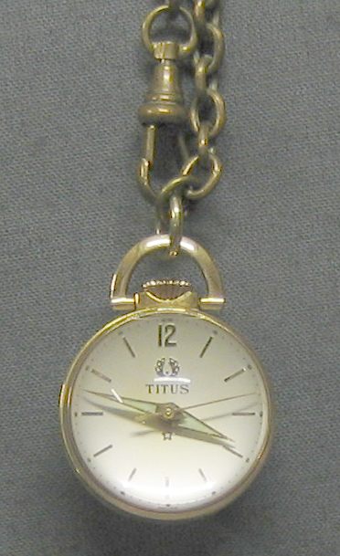 A Titus watch ball hung on a gilt chain | 28th July 2004 | Denhams