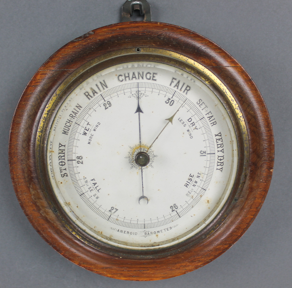 An aneroid barometer with paper dial, contained in a | 5th November ...