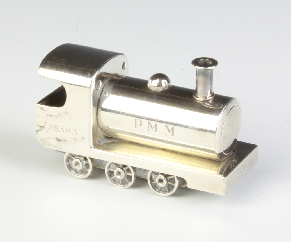 A silver model of a steam locomotive, with engraved | 10th October 2018 ...