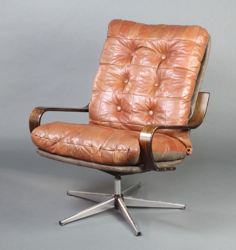A 1960's chrome and leather revolving open arm chair | 16th January ...