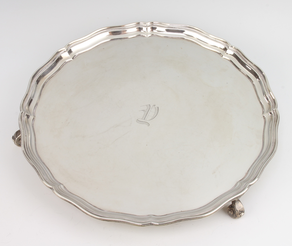 A silver salver with pie crust rim on scroll feet | 17th June 2021 ...