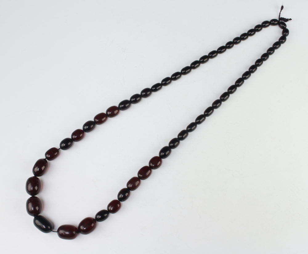 A set of red graduated amberoid beads 98 cm | 15th July 2021 | Denhams