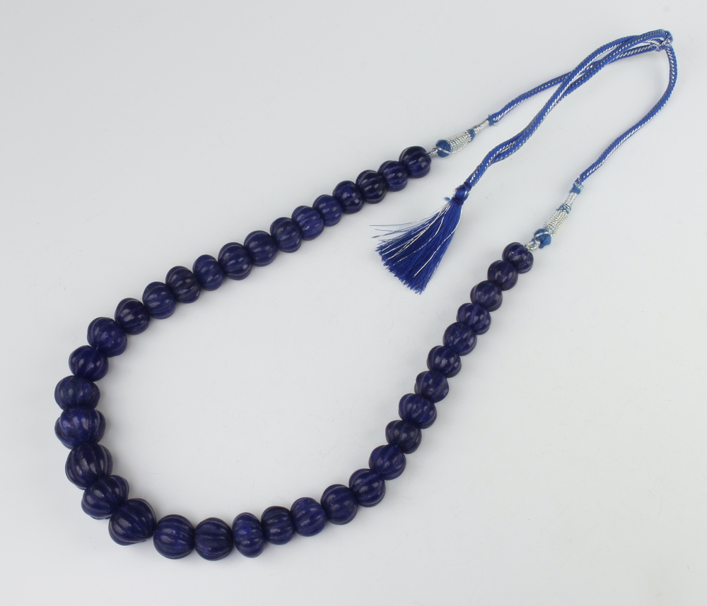 A strand of graduated carved blue hardstone beads 38cm | 9th September ...