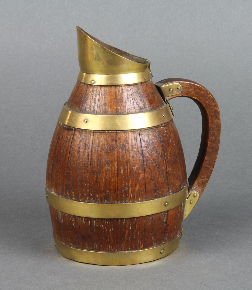 An oak and brass coopered jug 18cm x 10cm | 10th February 2022 | Denhams
