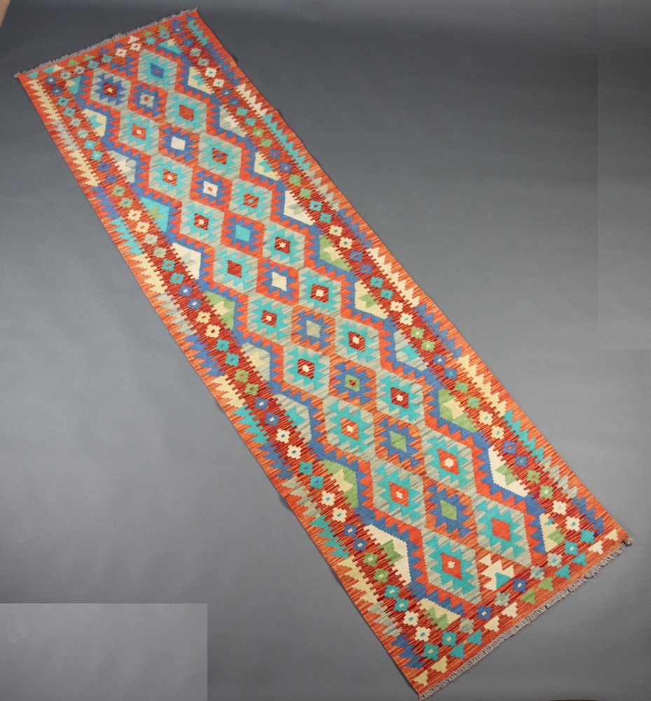 A blue, turquoise and orange ground Chobi Kilim runner | 10th February ...