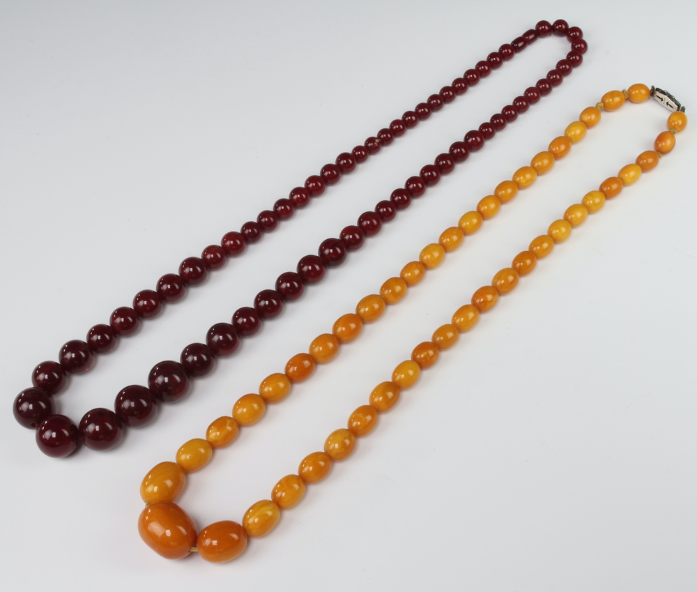 An orange amberoid bead necklace 74cm, a red ditto | 4th May 2022 | Denhams