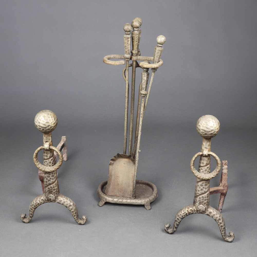 A pair of planished metal fire dogs 45cm h x 25cm | 4th May 2022 | Denhams