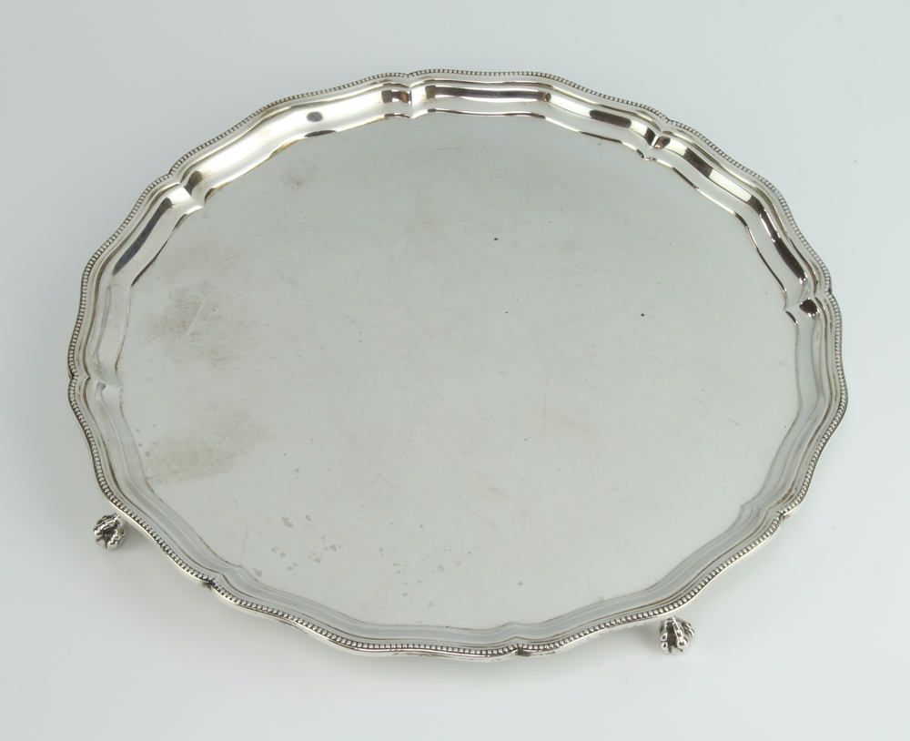 A silver salver with pie crust rim on claw and ball | 29th June 2022 ...