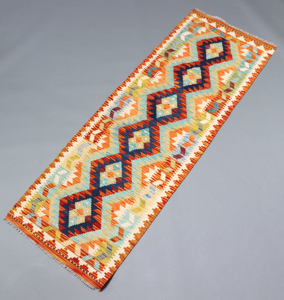A tan, orange and black ground Chobi Kilim runner with | 27th July 2022 ...