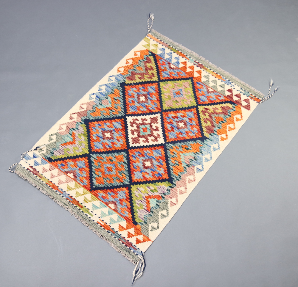 A white, black and orange ground Chobi Kilim rug with | 24th August ...