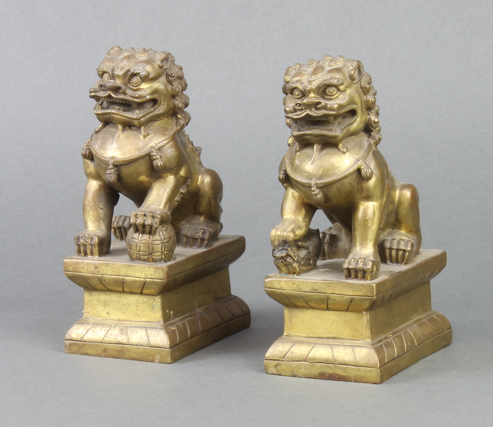 A pair of gilt bronze figures of Dogs of Fo raised on | 21st September ...
