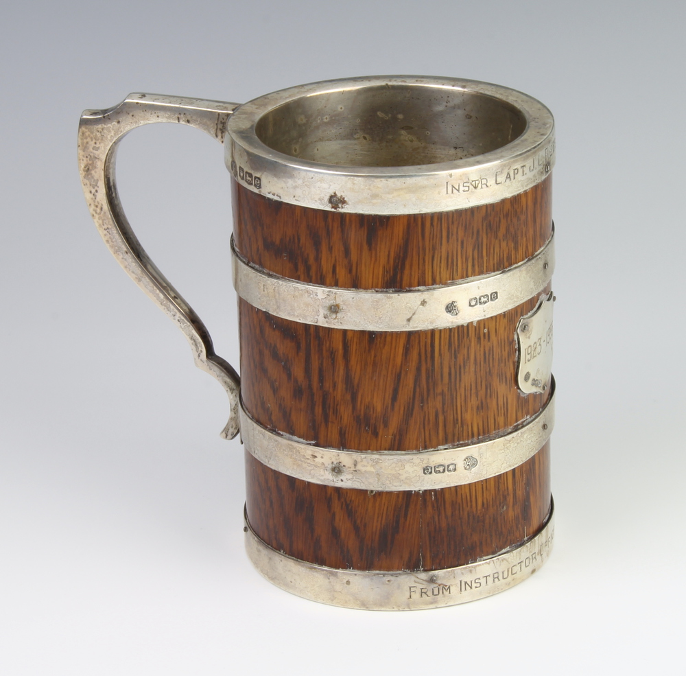 A silver banded oak mug with engraved shield, | 19th October 2022 | Denhams