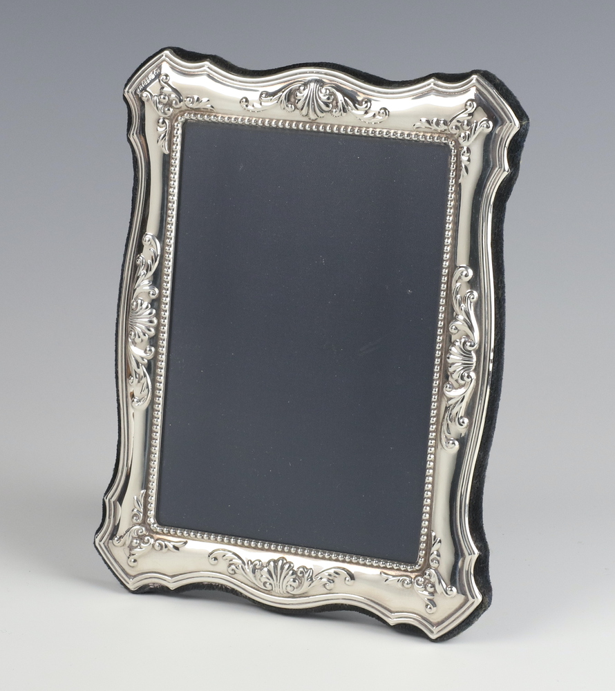 A modern repousse silver photograph frame decorated | 15th December ...