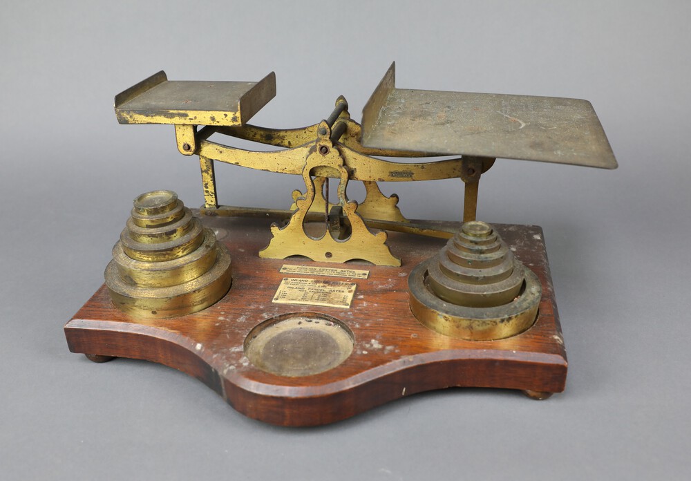 A pair of gilt metal postage scales on an oak base | 13th July 2023 ...