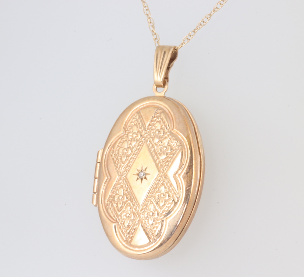 An oval 9ct yellow gold locket and chain, gross weight | 1st November ...