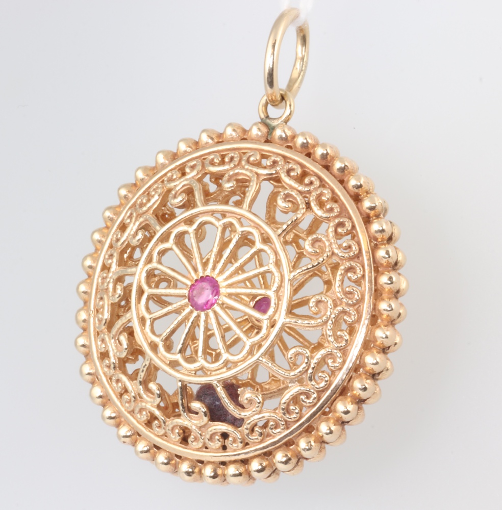 A pierced yellow metal pendant set a ruby 19.4 grams | 15th May 2024 | Denhams