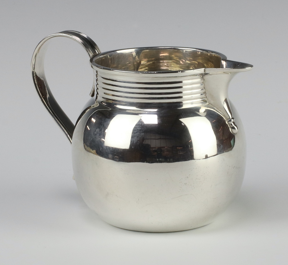 A Georgian style silver jug with ring turned lip, | 12th June 2024 ...