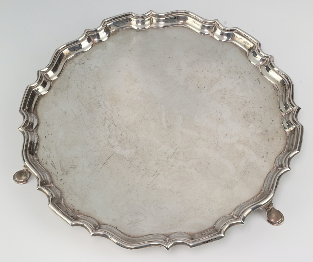 A silver salver with pie crust rim on hoof feet, | 10th July 2024 | Denhams