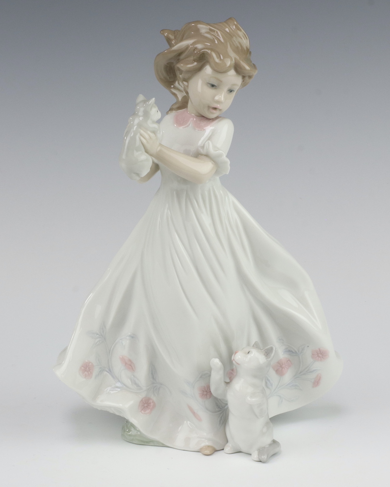 A Lladro figure of a girl holding a kitten, a 2003 | 7th August 2024 ...