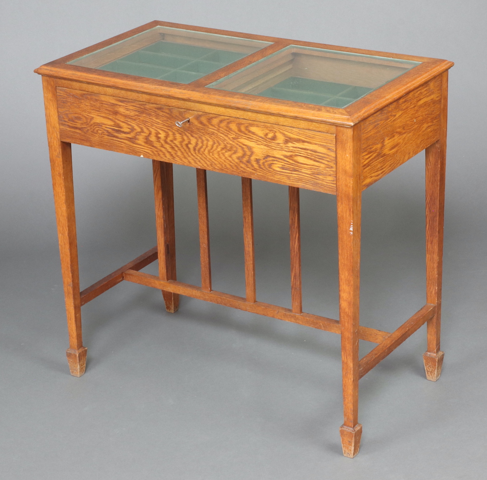 An Edwardian oak rectangular oak display table with | 5th September ...