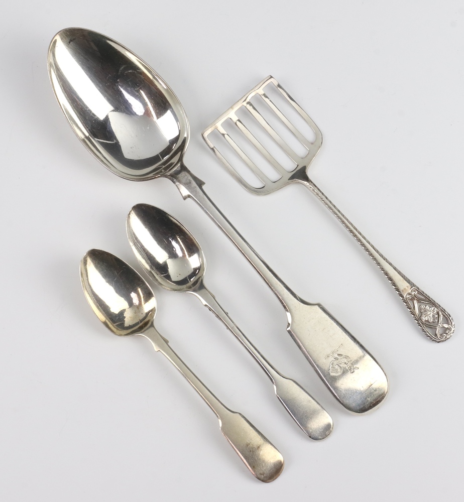 A silver serving slice, 2 teaspoons and a plated | 27th November 2024 ...