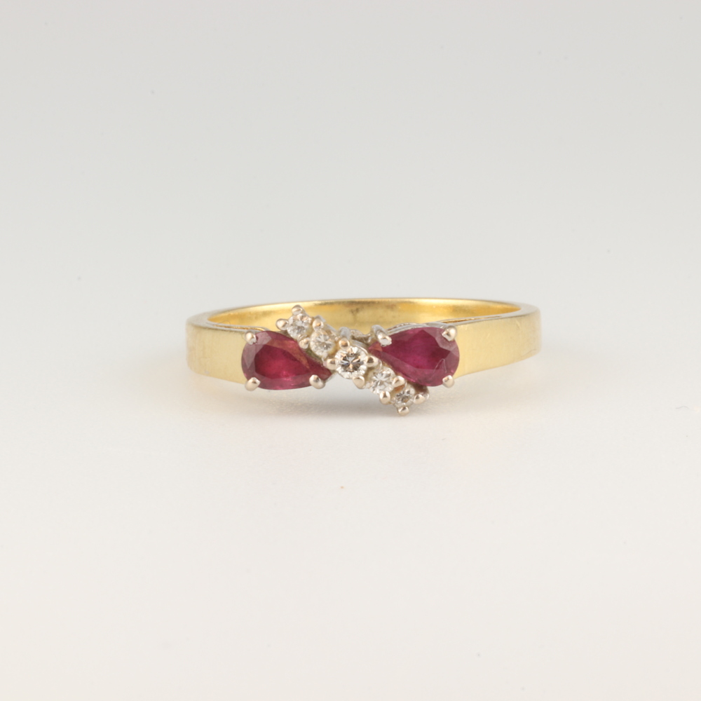 An 18ct yellow gold diamond and ruby crossover ring, | 27th November ...