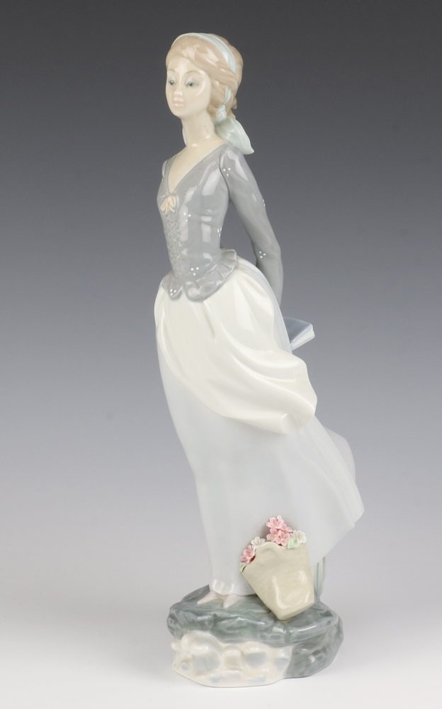 A Lladro figure of a standing lady on a cliff edge | 12th March 2025 ...