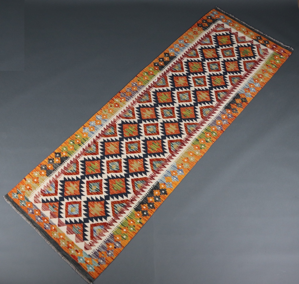 A white, black and orange ground Chobi Kilim runner | 10th April 2025 ...