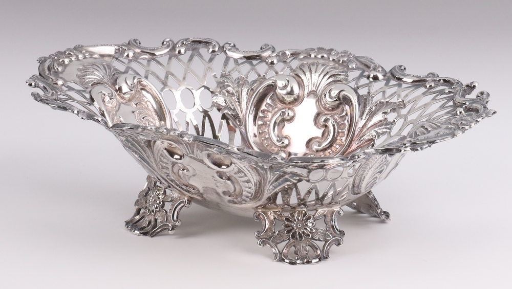 A Victorian pierced silver dish with scroll panels on | 7th May 2025 ...