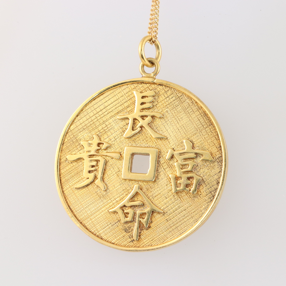A 14ct yellow gold circular engine turned pendant with | 7th May 2025 ...