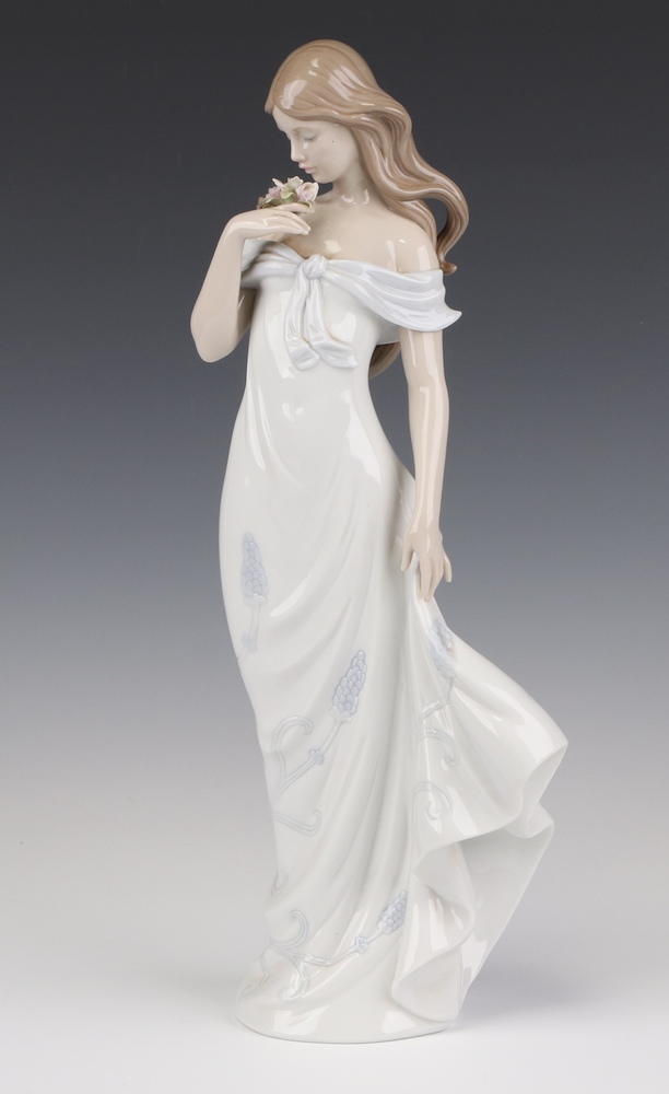 A Lladro figure of a standing lady holding a bunch of | 30th July 2025 ...