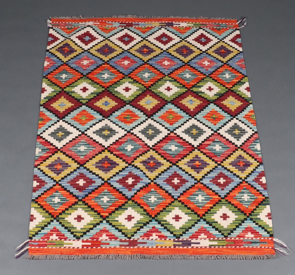 A green, white and orange ground Chobi Kilim rug with | 19th November ...